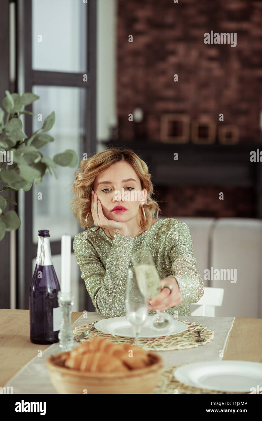 Lonely girlfriend feeling awful after breakup drinking alone Stock ...
