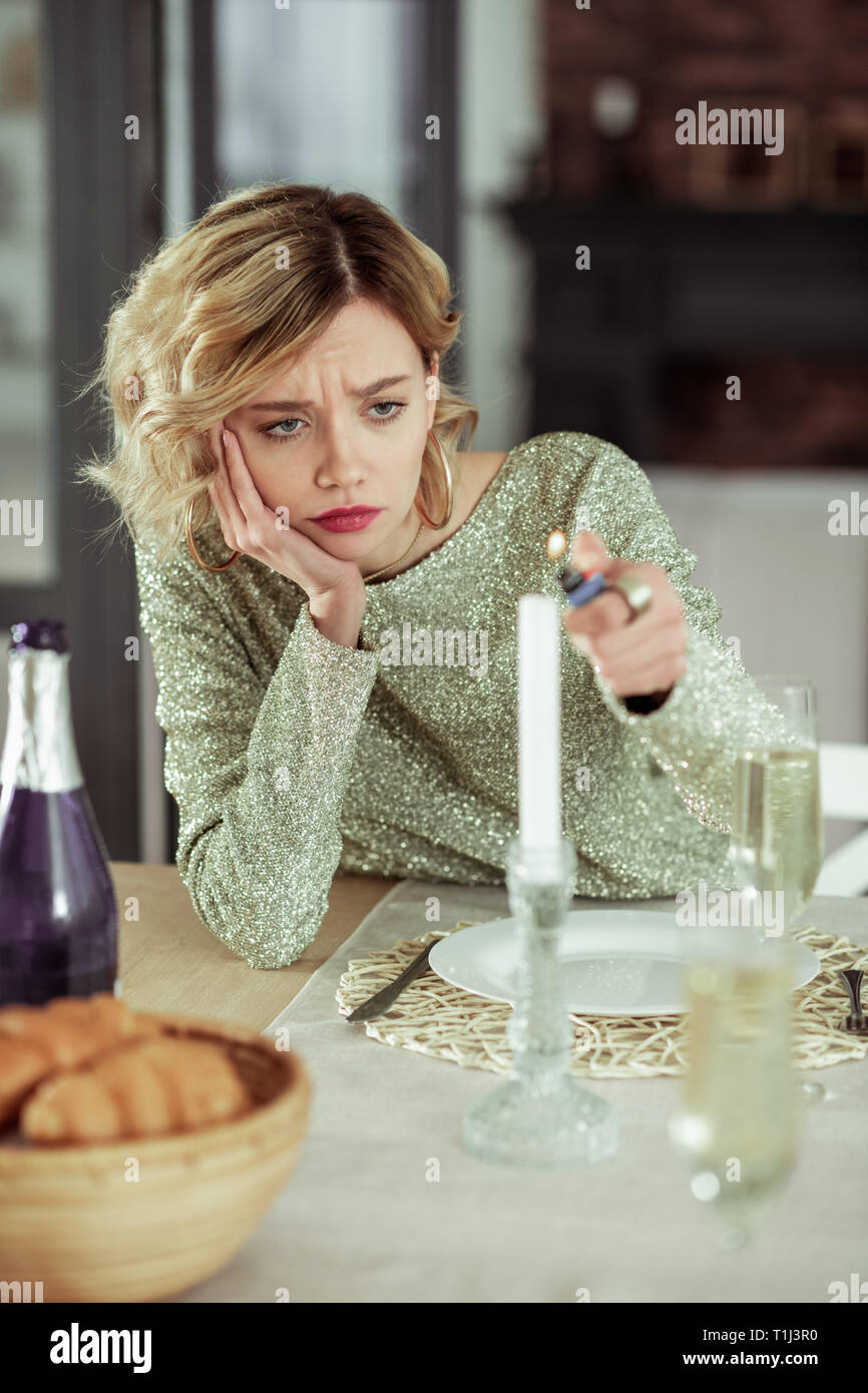 Woman wearing shiny dress feeling sad after breakup Stock Photo - Alamy