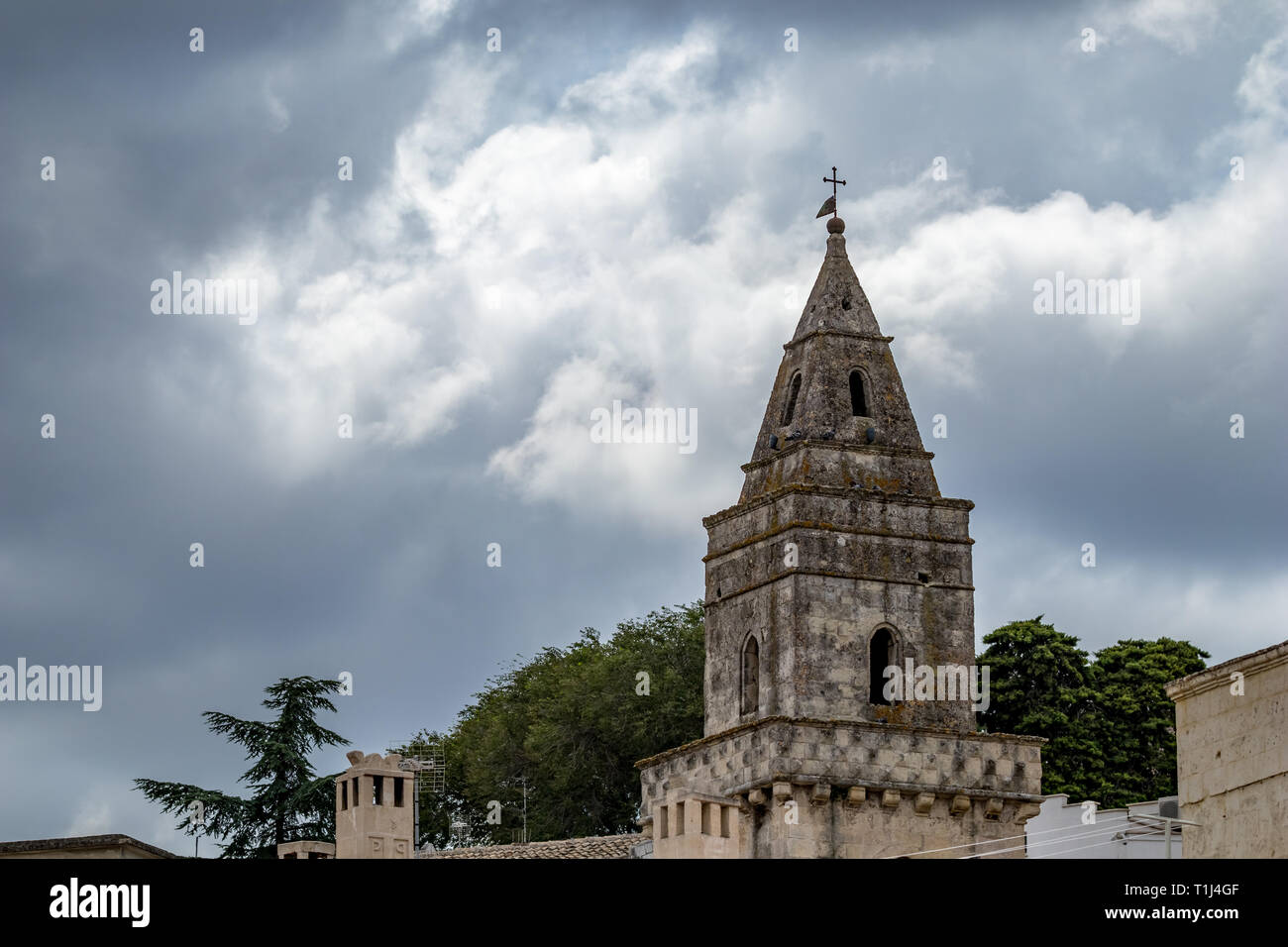 Summer blue sky and church roof with religious cross, view of ancient ...