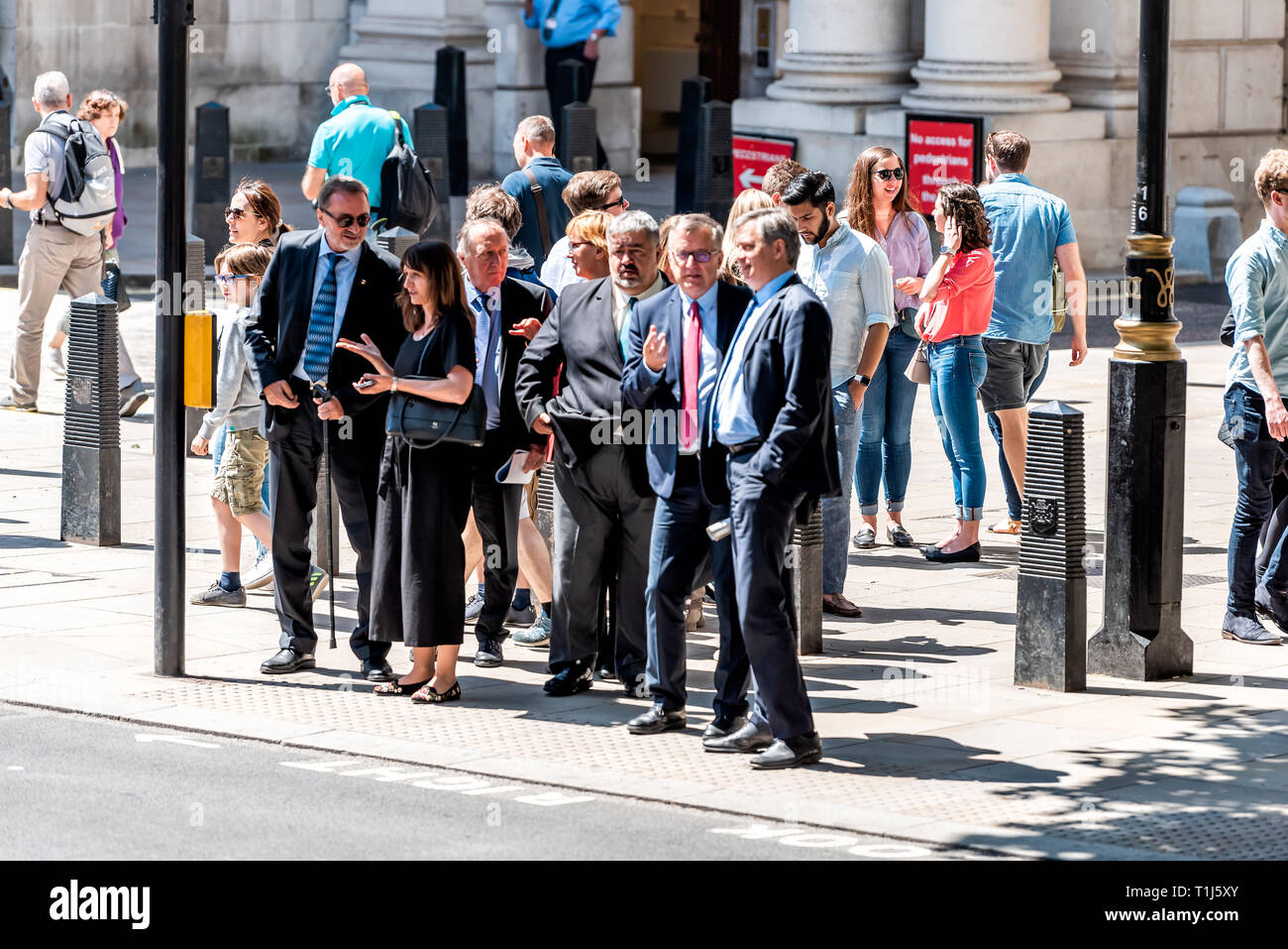 London, UK - June 22, 2018: Men businessman standing waiting for ...