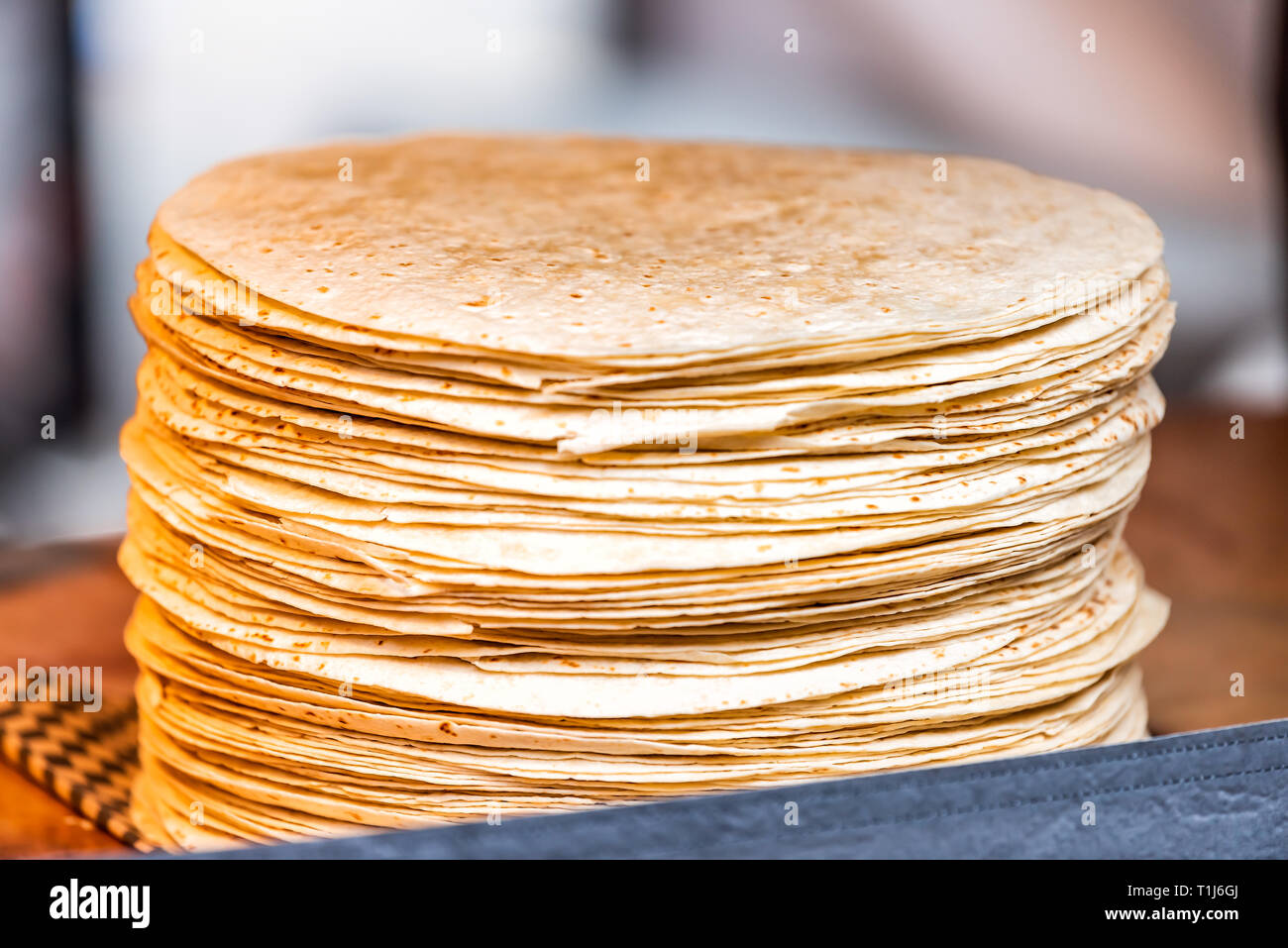 Street food stall vendor outside with nobody and closeup of stack of ...