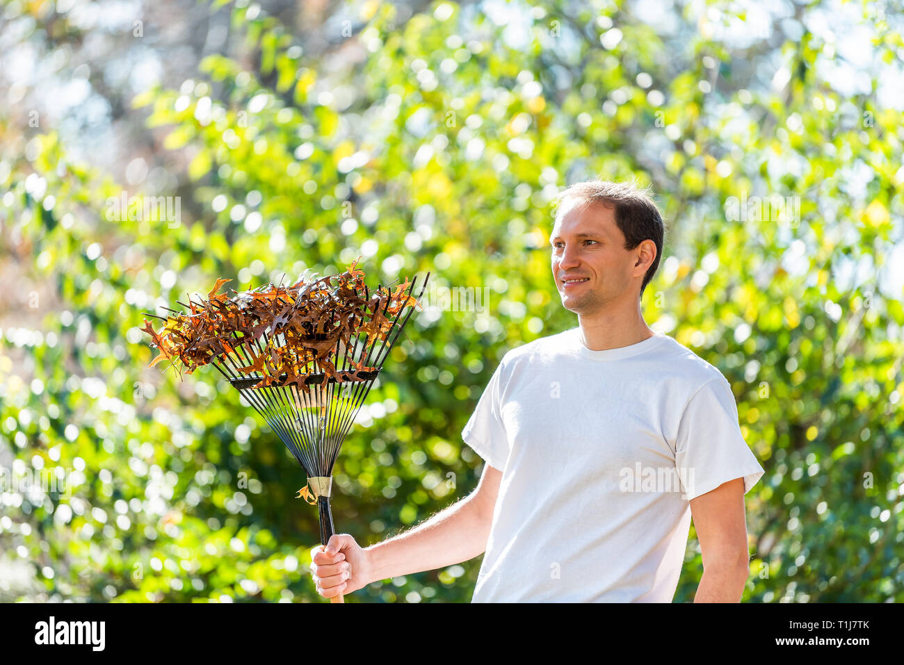 Person raking hi-res stock photography and images - Alamy
