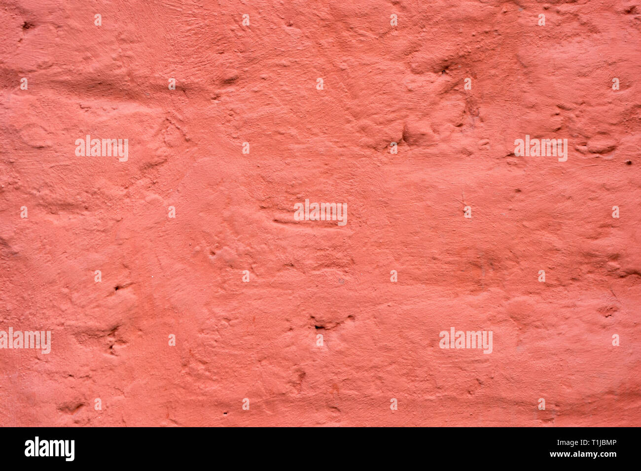 Brick wall painted with thick red paint Stock Photo - Alamy