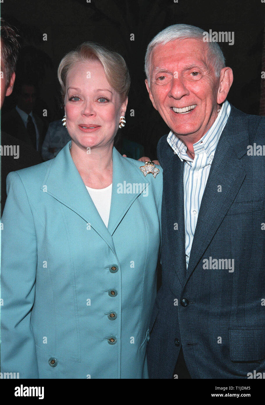 LOS ANGELES, CA - July 19, 1999: Producer AARON SPELLING & wife CANDY ...