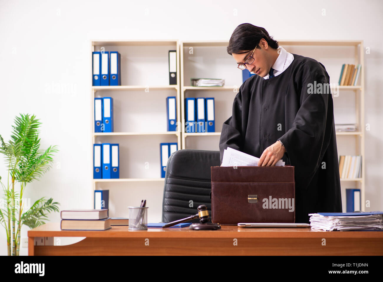 Young handsome judge working in court Stock Photo - Alamy