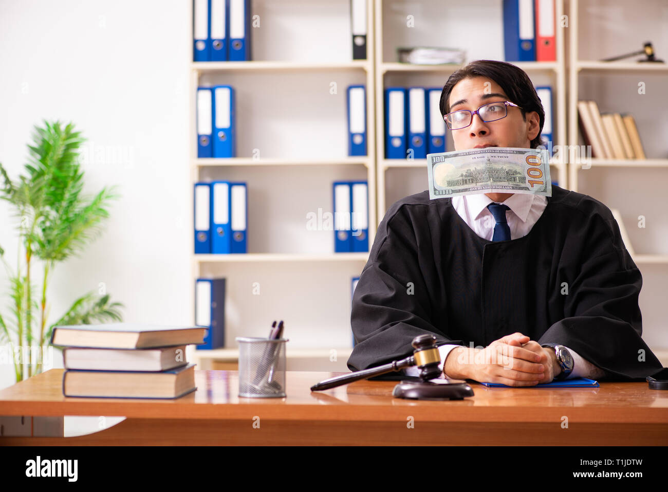 Young handsome judge working in court Stock Photo - Alamy