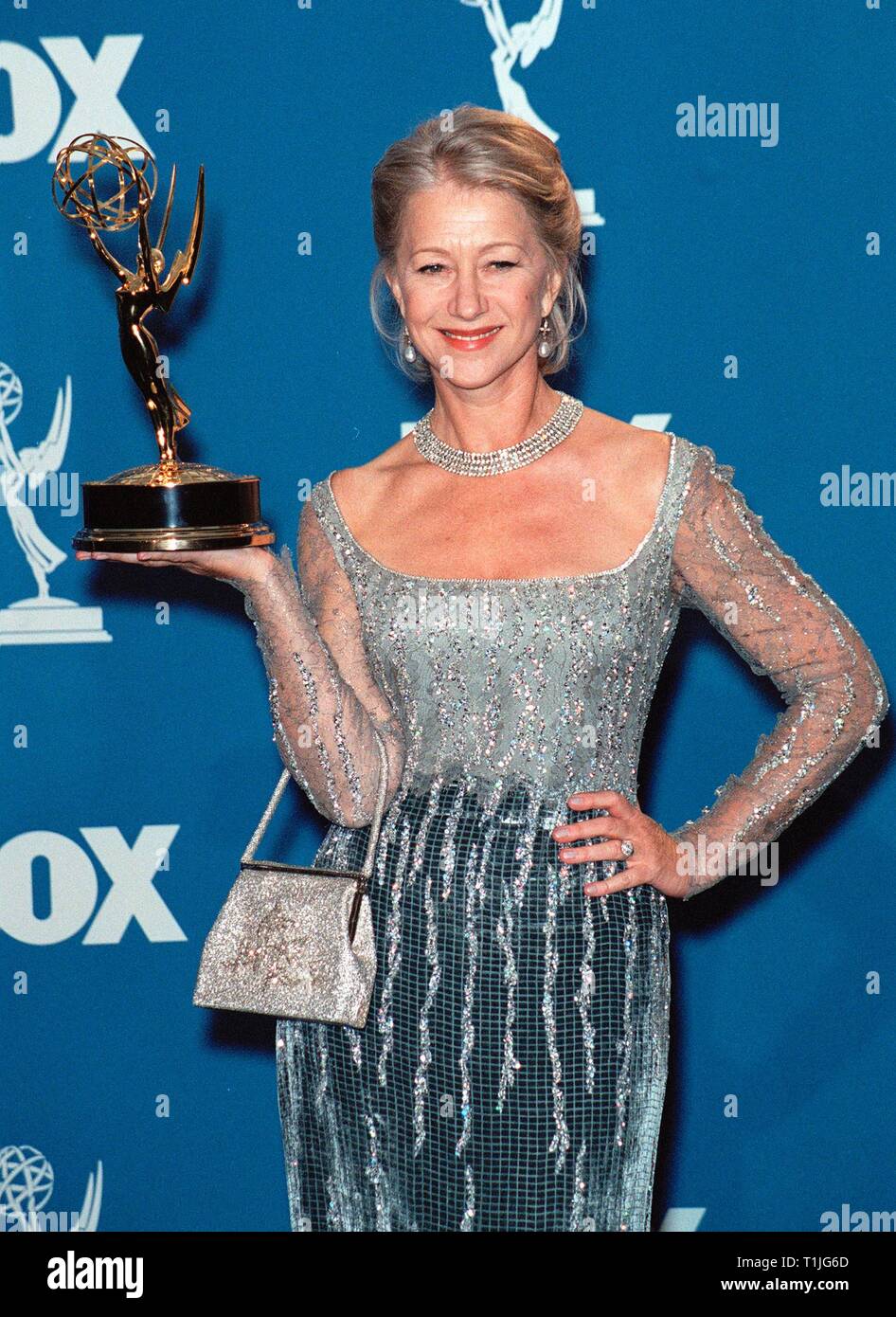 LOS ANGELES, CA - February 12, 1999: Actress HELEN MIRREN with her Emmy ...
