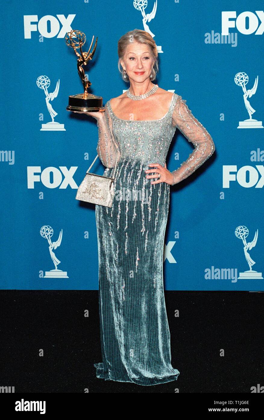 LOS ANGELES, CA - February 12, 1999: Actress HELEN MIRREN with her Emmy ...