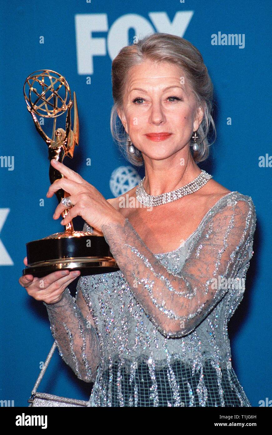 LOS ANGELES, CA - February 12, 1999: Actress HELEN MIRREN with her Emmy ...