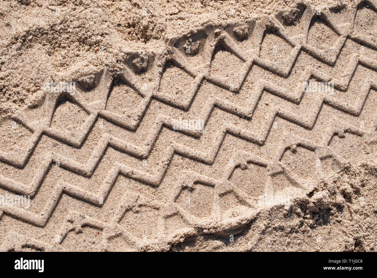 Tire track imprints in the sand Stock Photo - Alamy