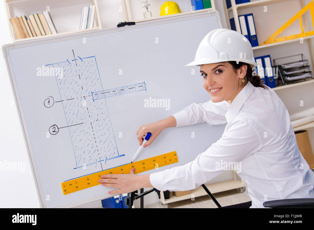 Female architect working in the office Stock Photo - Alamy