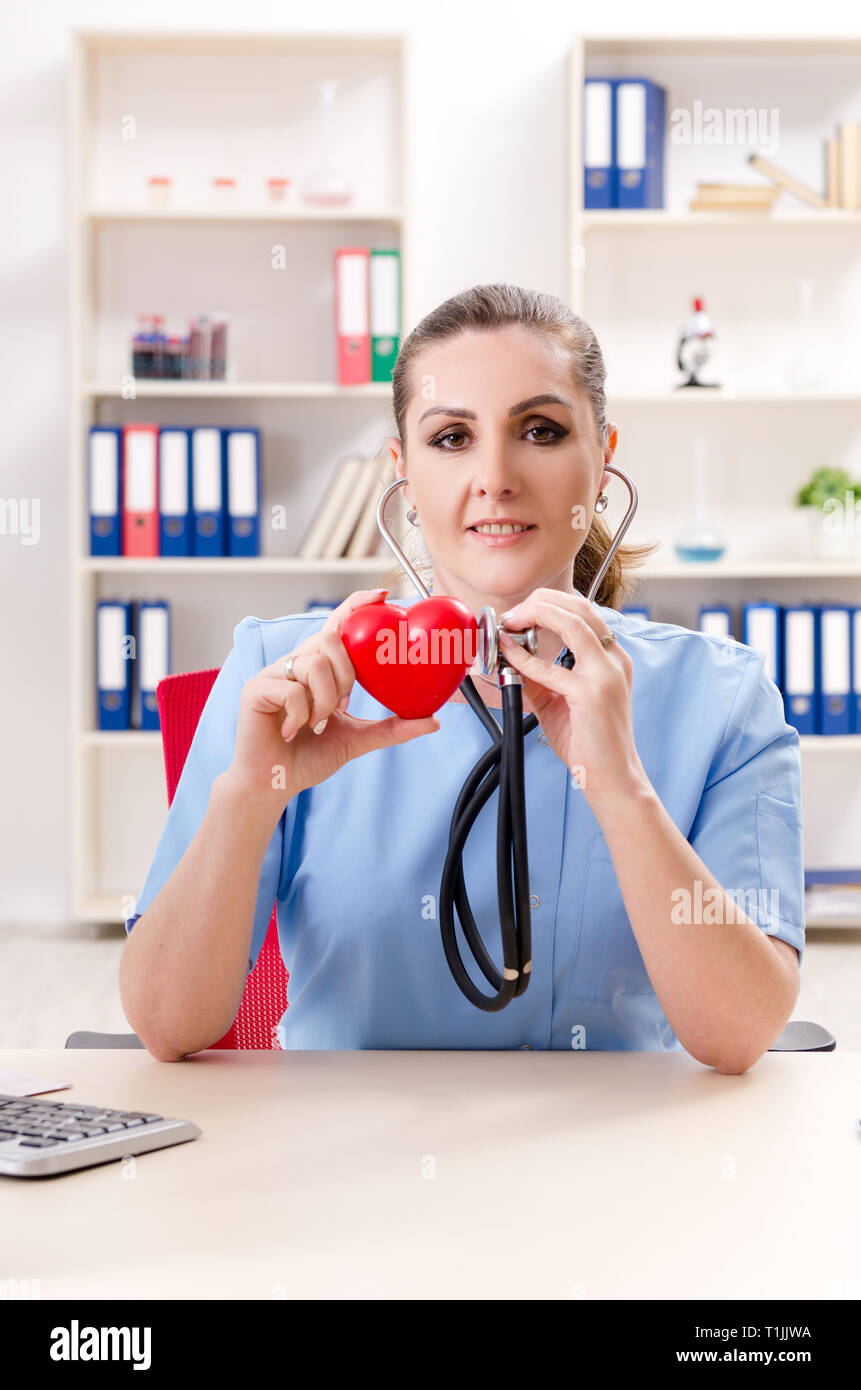 Female doctor cardiologist working in the clinic Stock Photo - Alamy