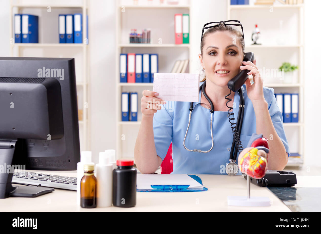 Female doctor cardiologist working in the clinic Stock Photo - Alamy