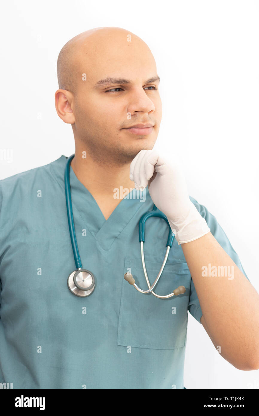 Bald doctor with medical scrubs Stock Photo - Alamy