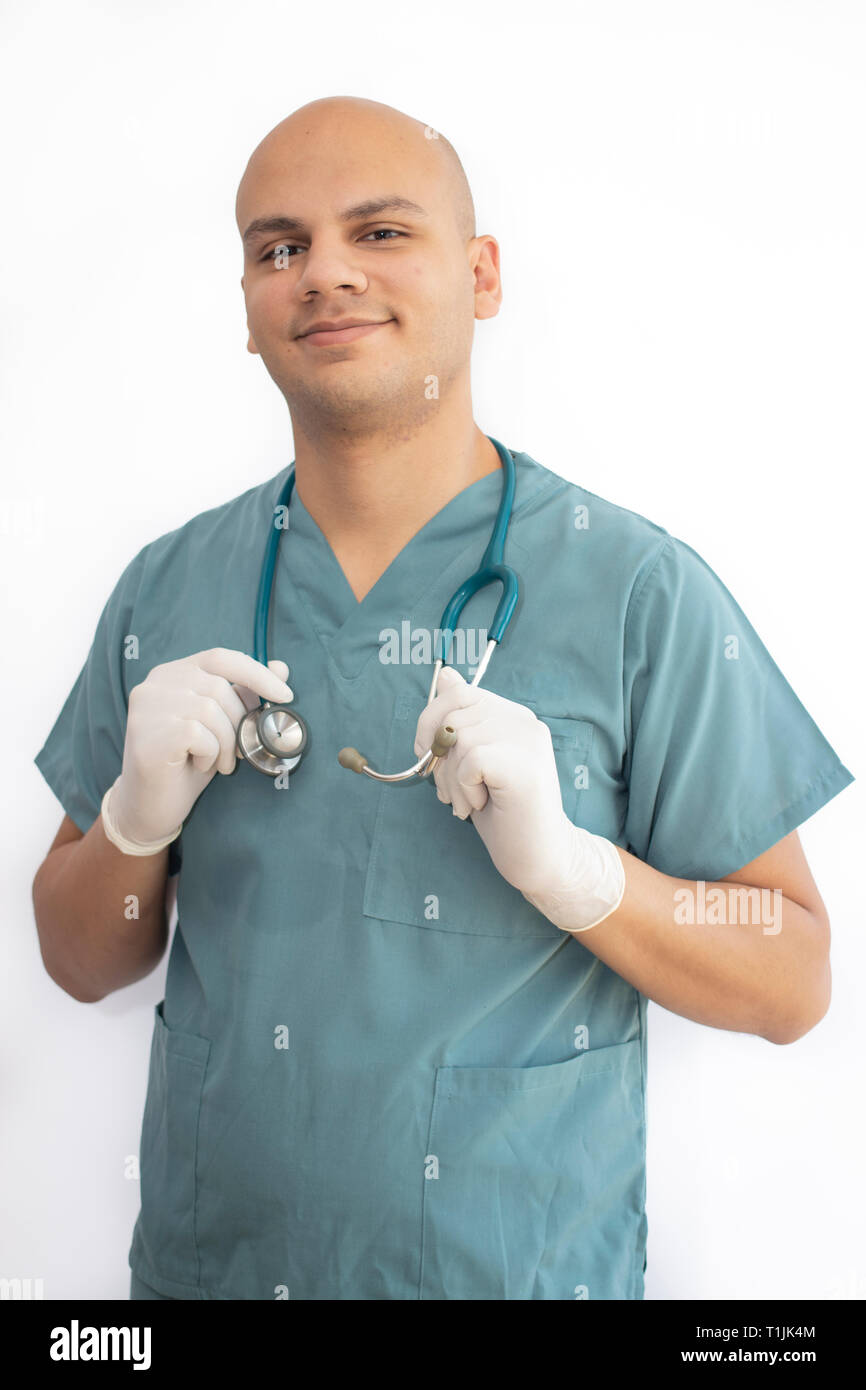 Bald doctor with medical scrubs Stock Photo - Alamy
