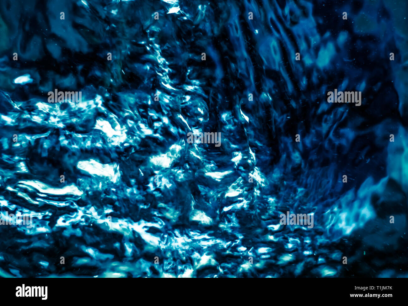 Abstract blue liquid surface as background - futuristic design and ...