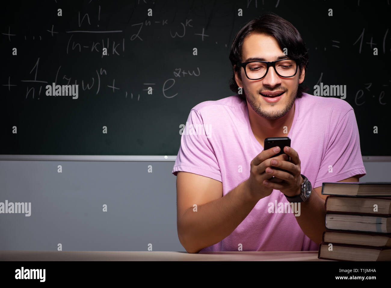 High school student texting in class hi-res stock photography and ...