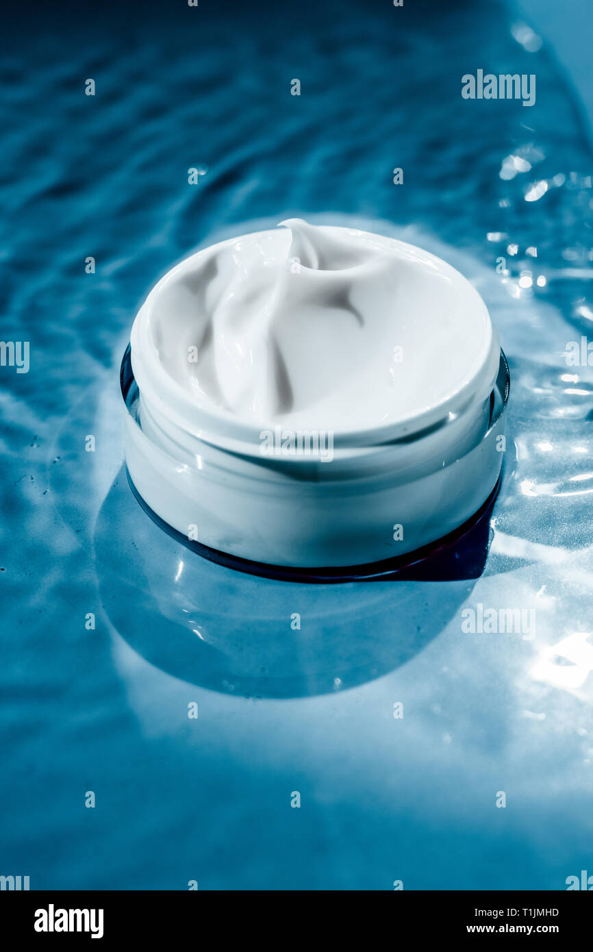 Sensitive skincare moisturizer cream on water background - clean beauty ...