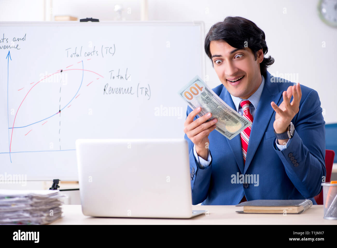 Busy businessman explaining business charts Stock Photo - Alamy