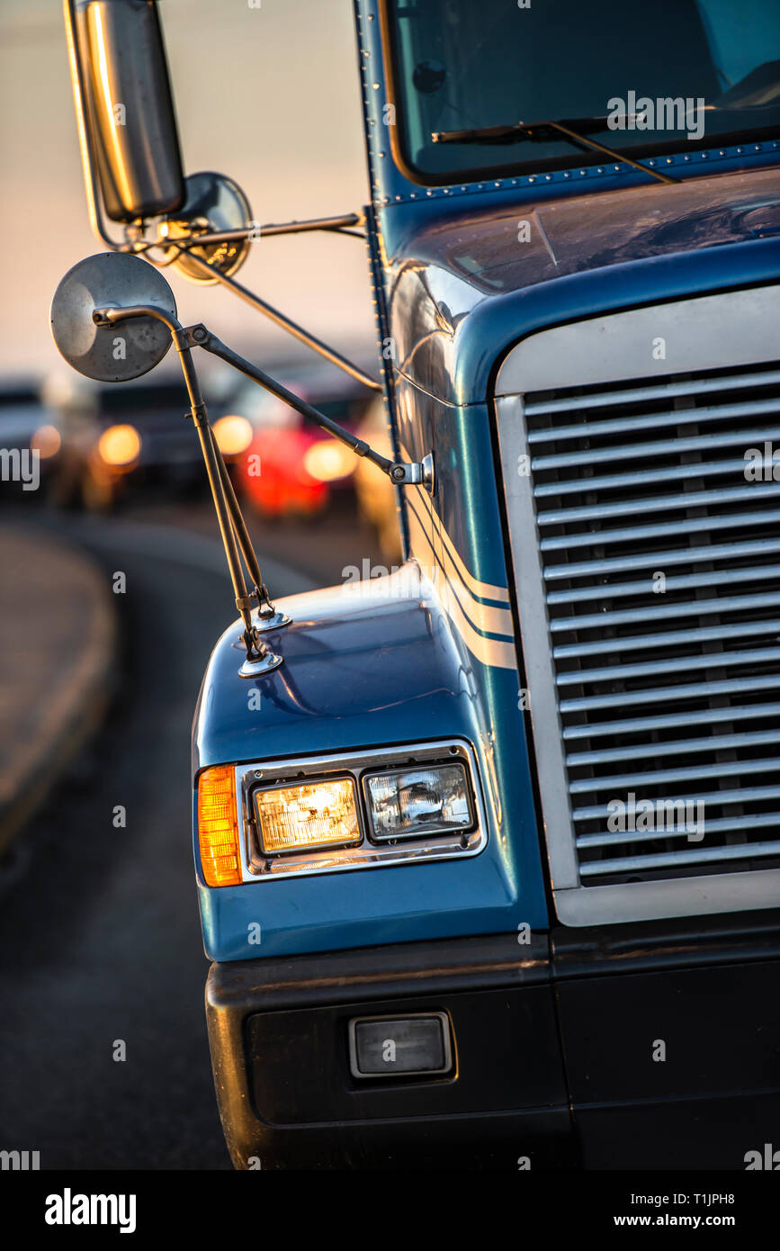 Front view of covered with road dust blue big rig American bonnet ...