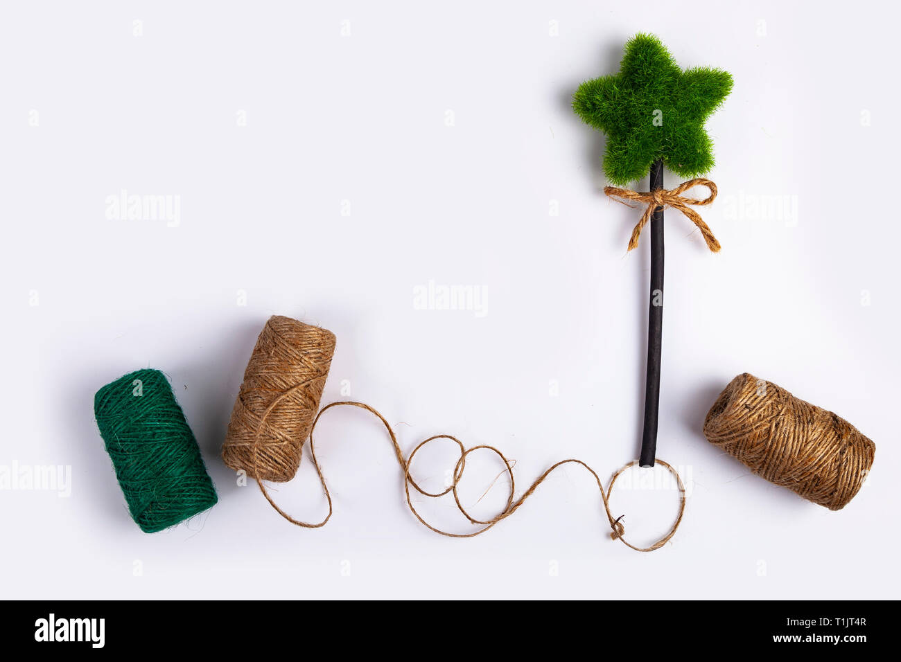 Decorative grass star and rope on a white background Stock Photo - Alamy