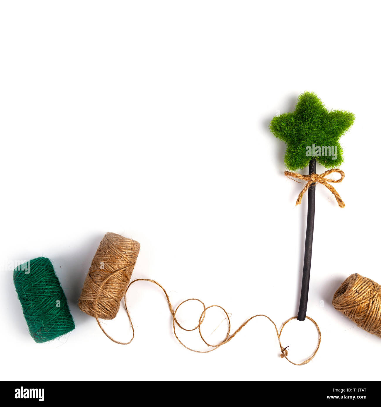 Decorative grass star and rope on a white background Stock Photo - Alamy