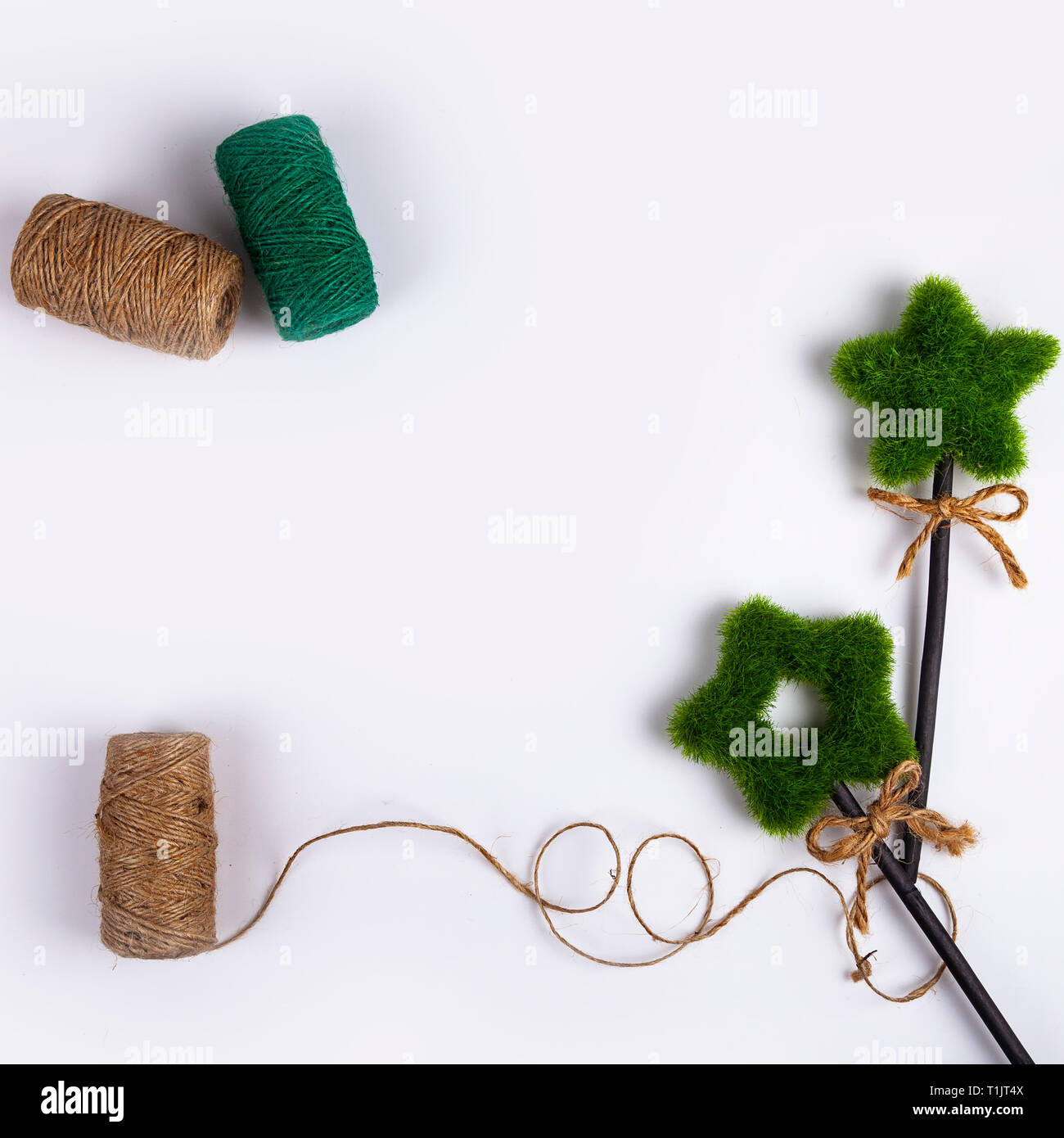 Decorative grass star and rope on a white background Stock Photo - Alamy