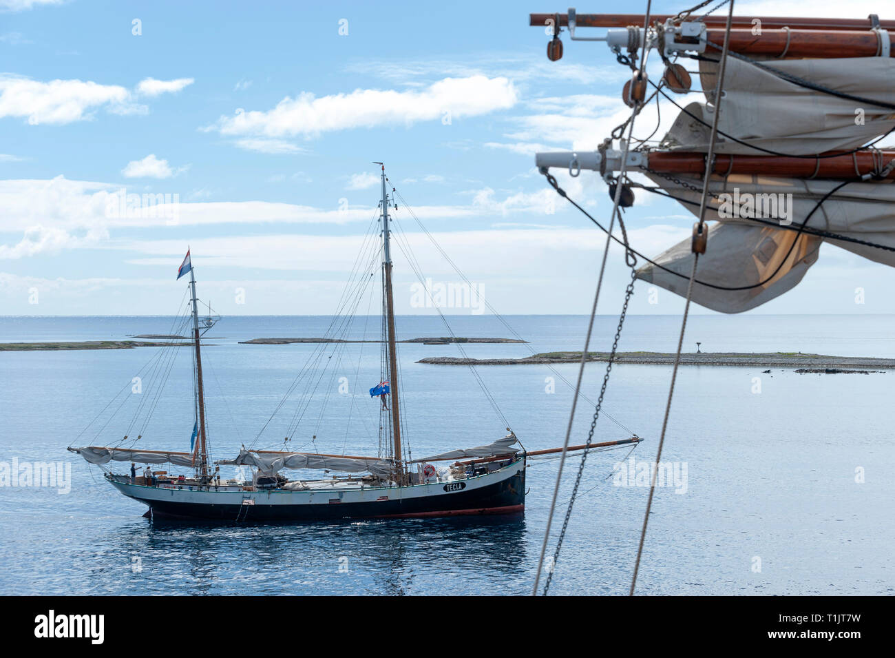 The Dutch tall ship Tecla sails past the Bark Europa on a calm ...