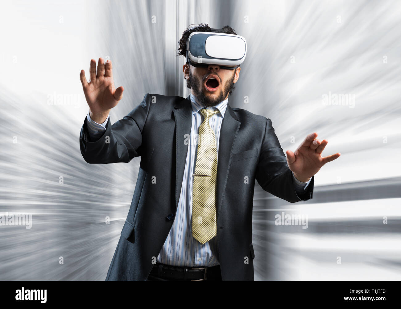 Handsome elegant businessman experiencing impressive virtual reality ...