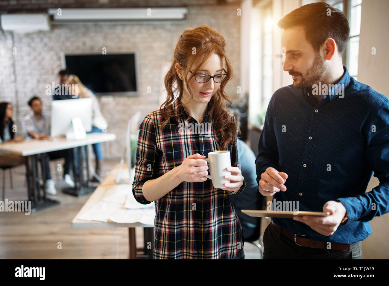 Portrait of architects having discussion in office Stock Photo - Alamy