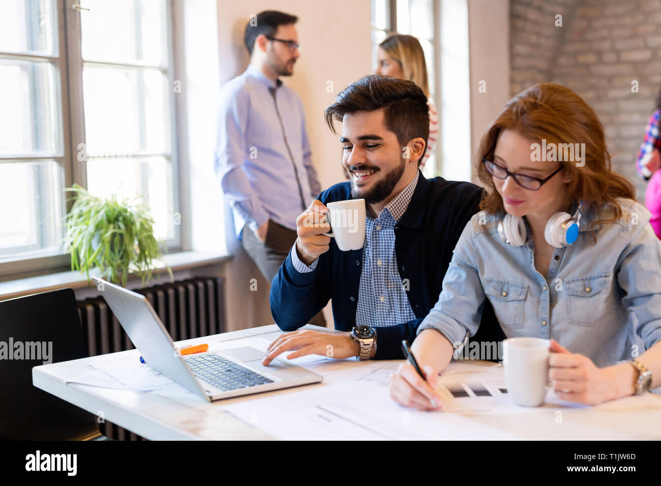 Company employees working in office Stock Photo - Alamy