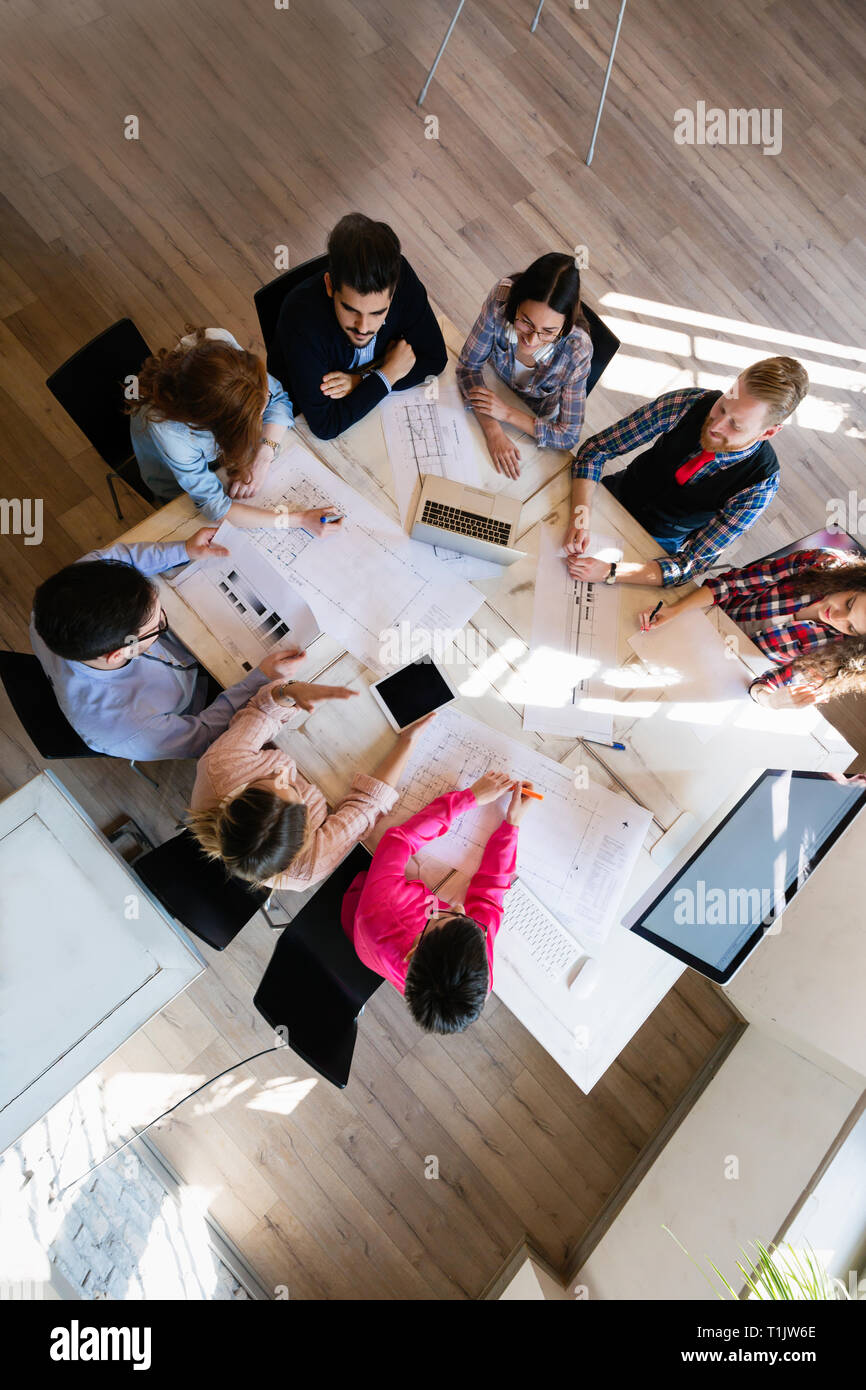 Business people and architects collaborating on project Stock Photo - Alamy