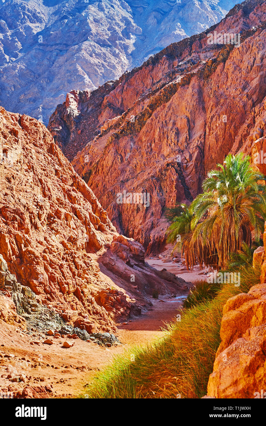 The curved path runs along the narrow Small Colored canyon with steep ...