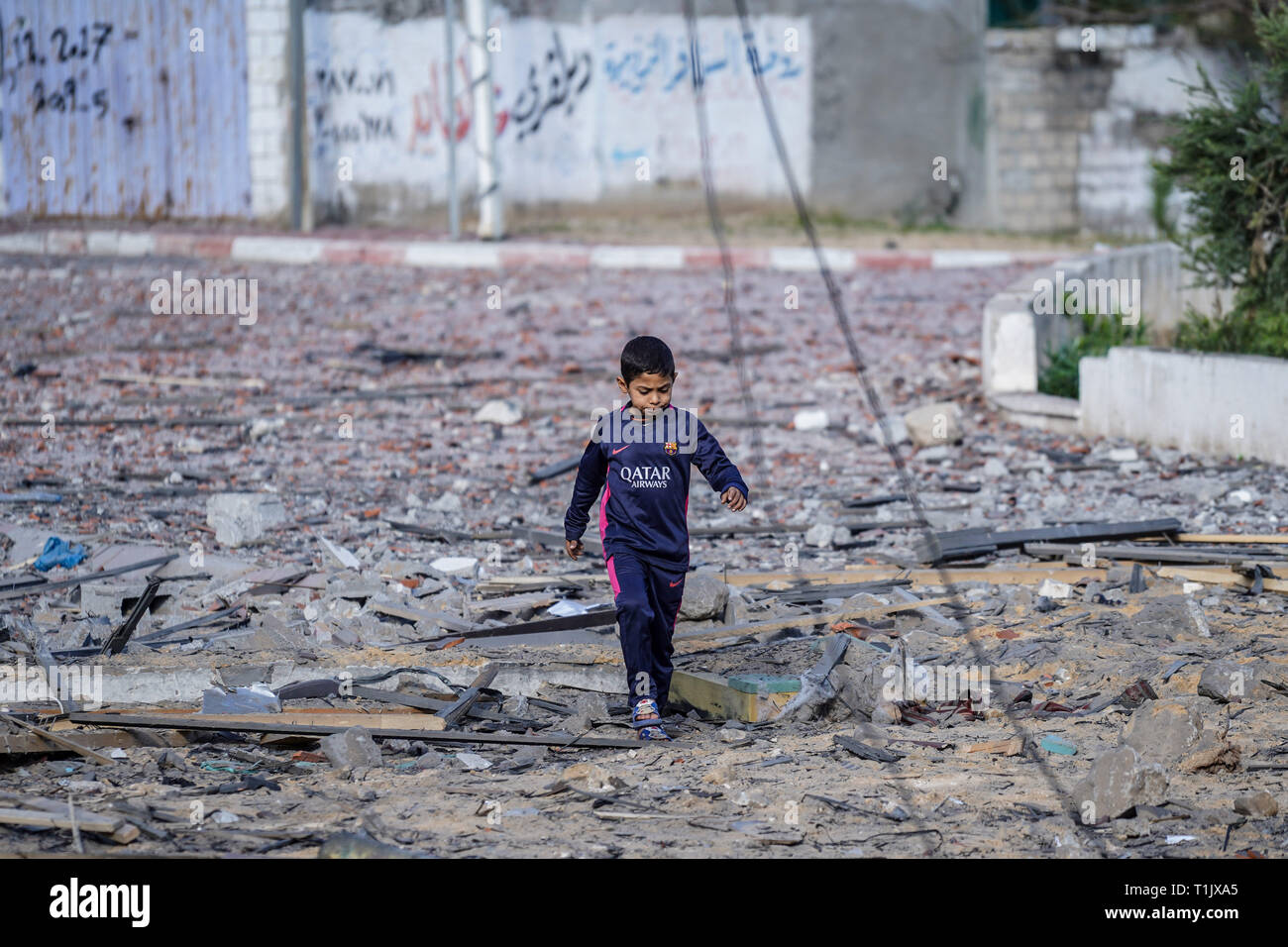 A child seen standing alone surrounded by rubbles after an Israeli ...