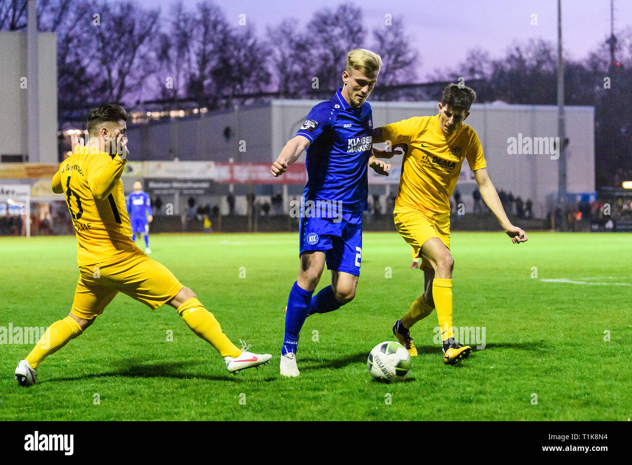 Mannheim, Deutschland. 27th Mar, 2019. Alexander Groiss (KSC) duels ...