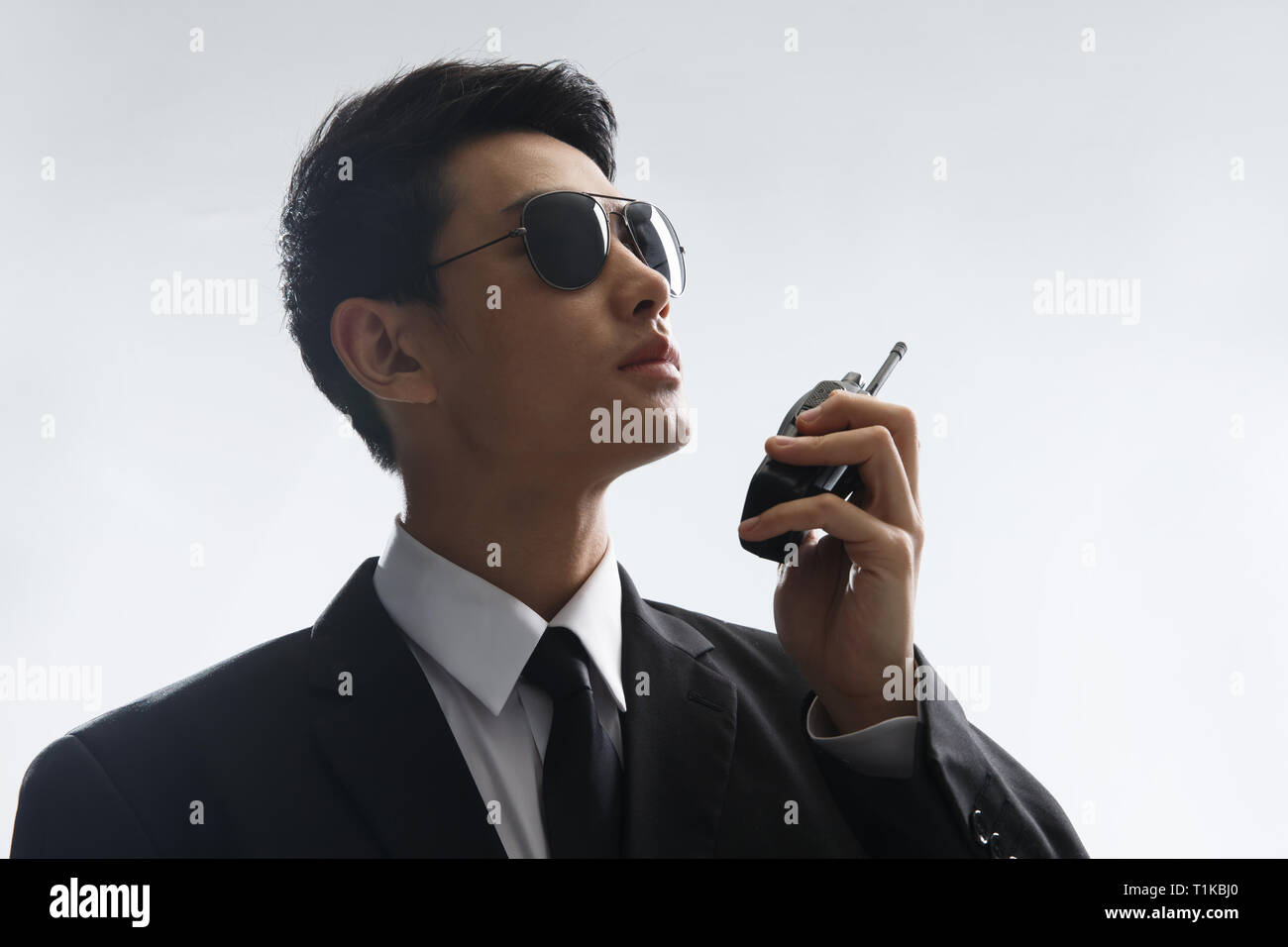Young male bodyguards Stock Photo - Alamy