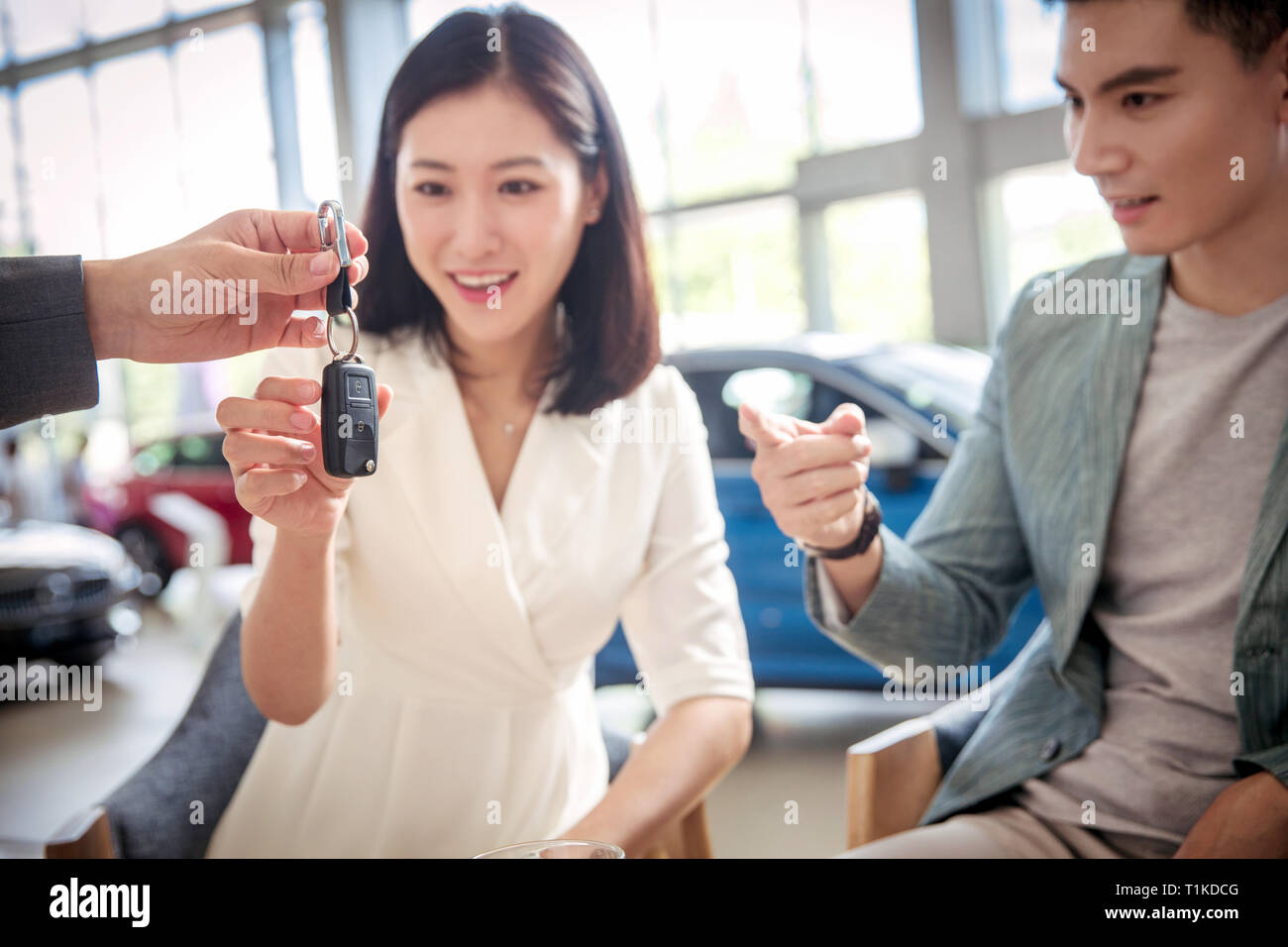 Car sales staff and customers Stock Photo - Alamy