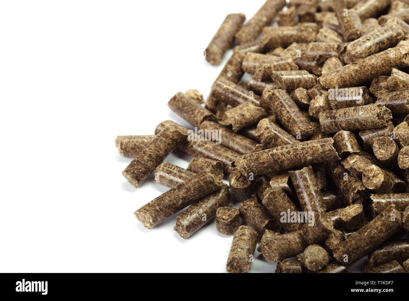 stack of wooden pellets for bio energy, white background, isolated ...