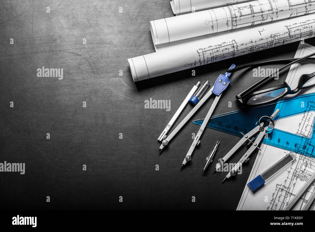 Construction planning drawings on black background Stock Photo - Alamy