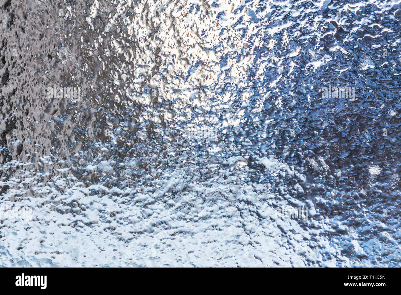 Frozen ice pattern on glass Stock Photo - Alamy