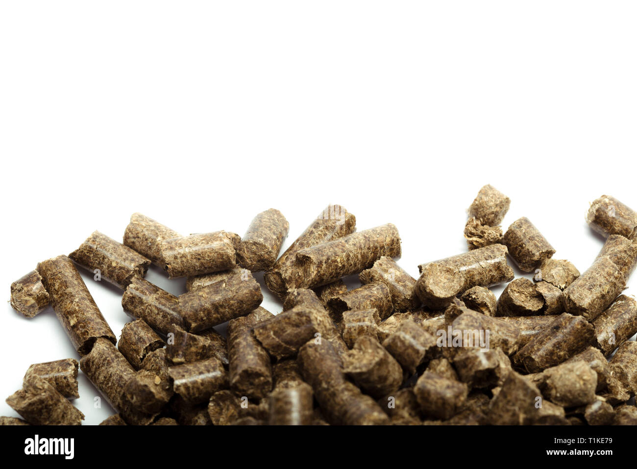 stack of wooden pellets for bio energy, white background, isolated ...