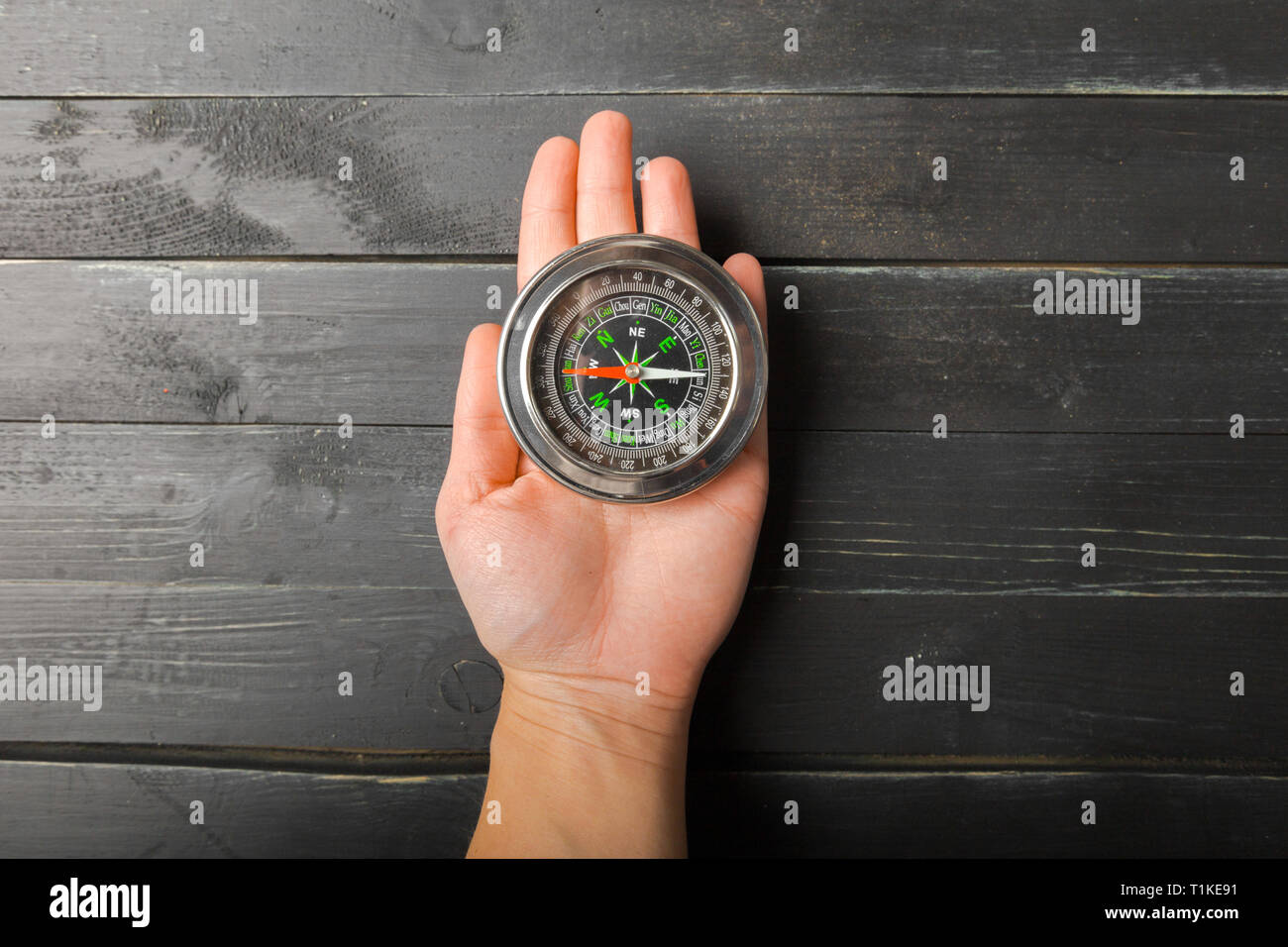 Man Hand Holding Chrome Compass Stock Photo - Alamy