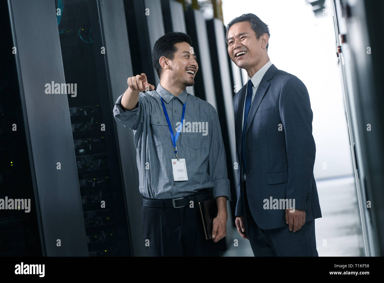 Technical personnel in machine room inspection Stock Photo - Alamy