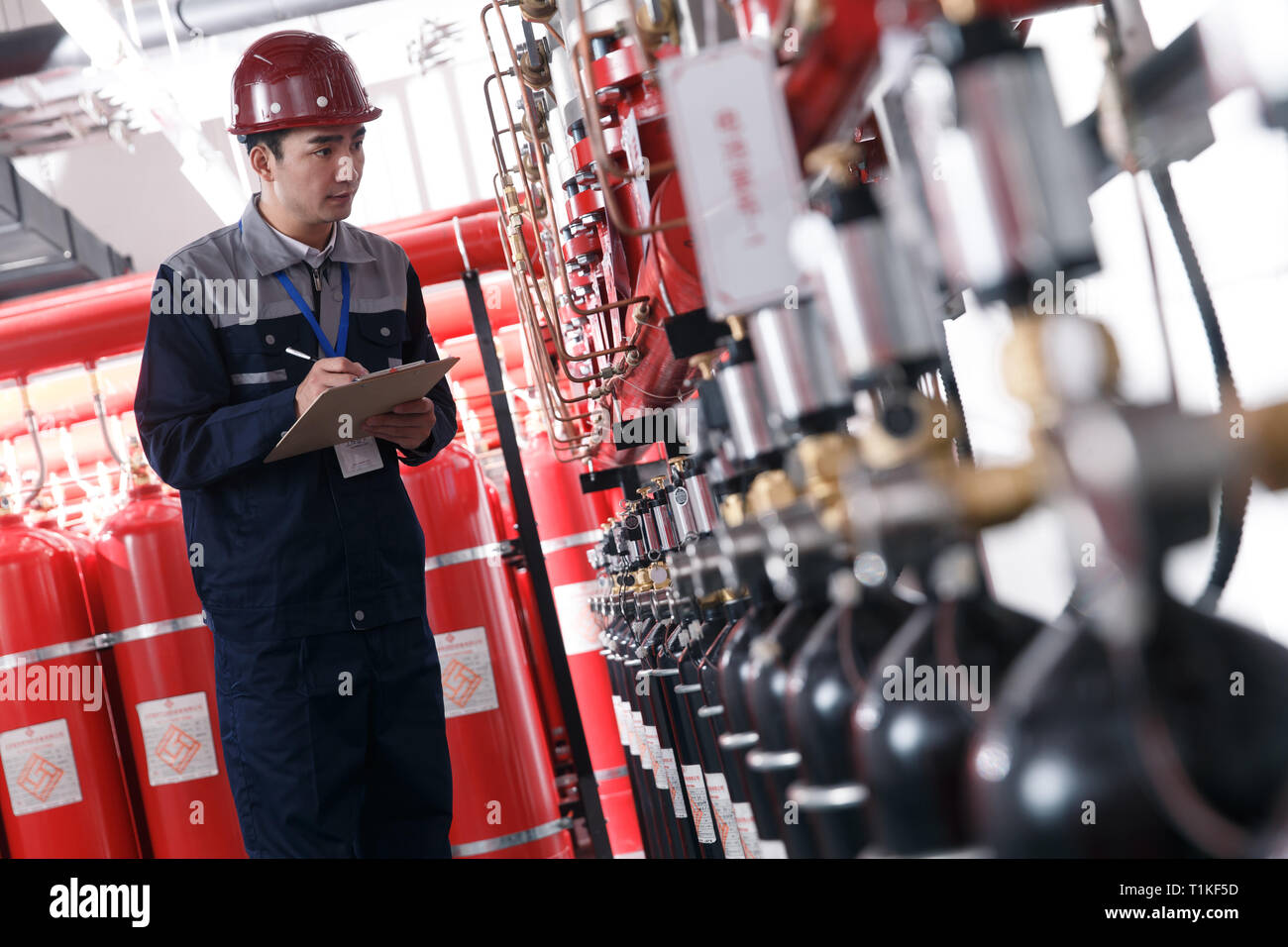 Technical personnel in the factory fire control room inspection Stock ...