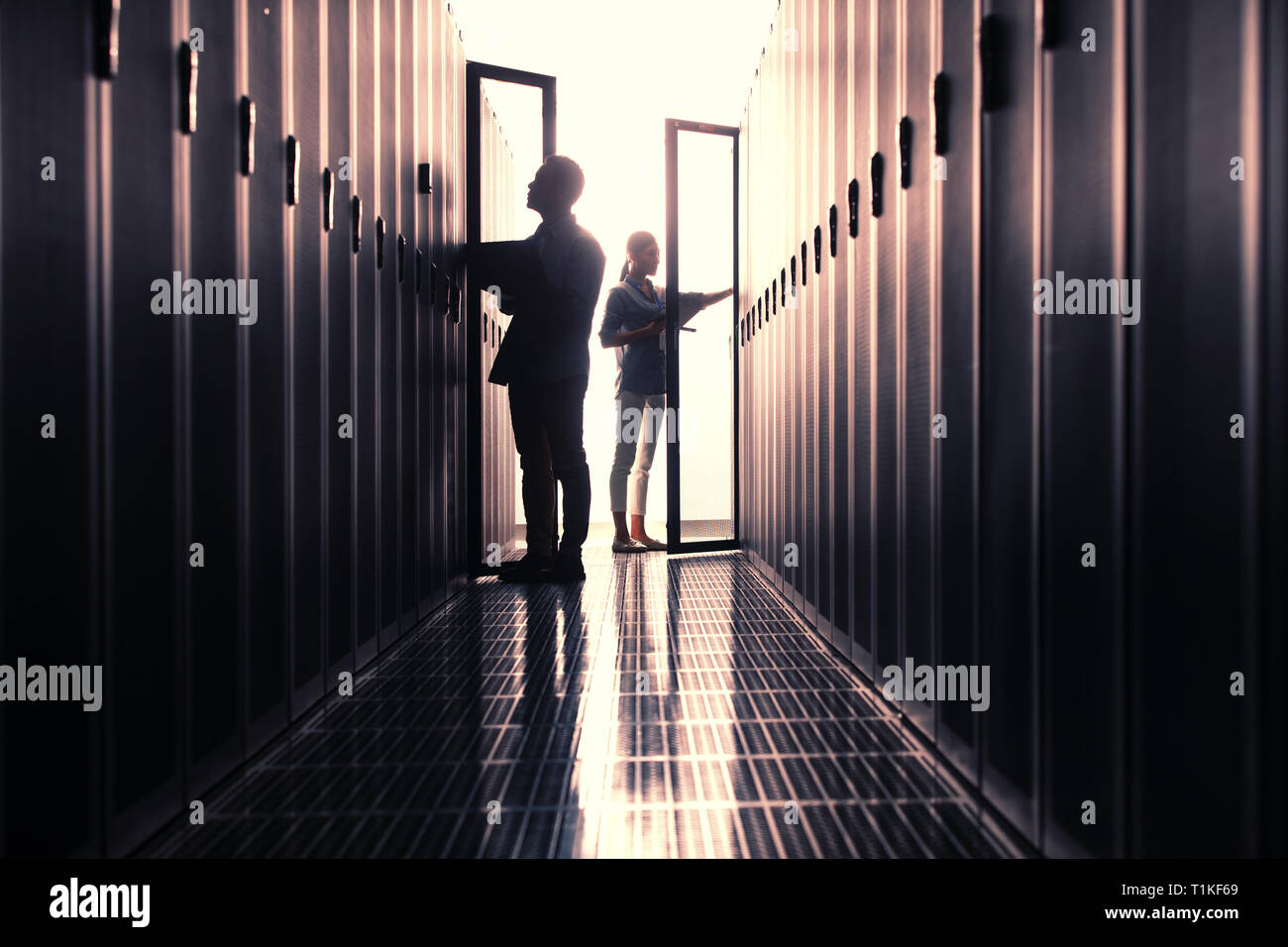 Technical staff in the computer room maintenance Stock Photo - Alamy