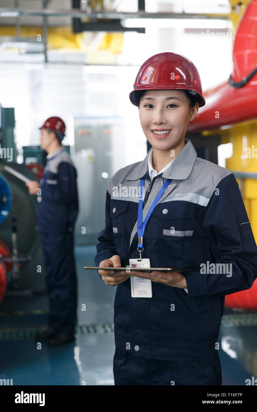 Technicians work in a factory Stock Photo - Alamy