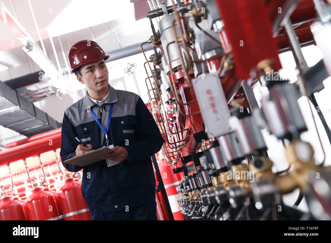 Technical personnel in the factory fire control room inspection Stock ...