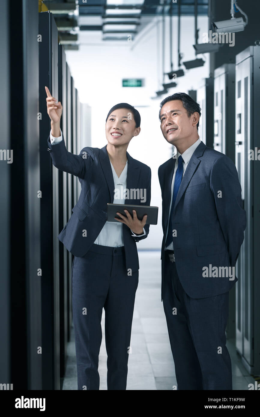 Technical personnel in machine room inspection Stock Photo - Alamy