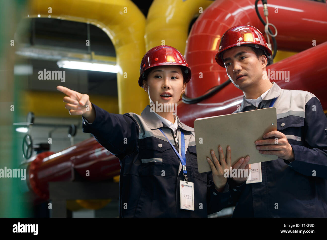 Technicians work in a factory Stock Photo - Alamy