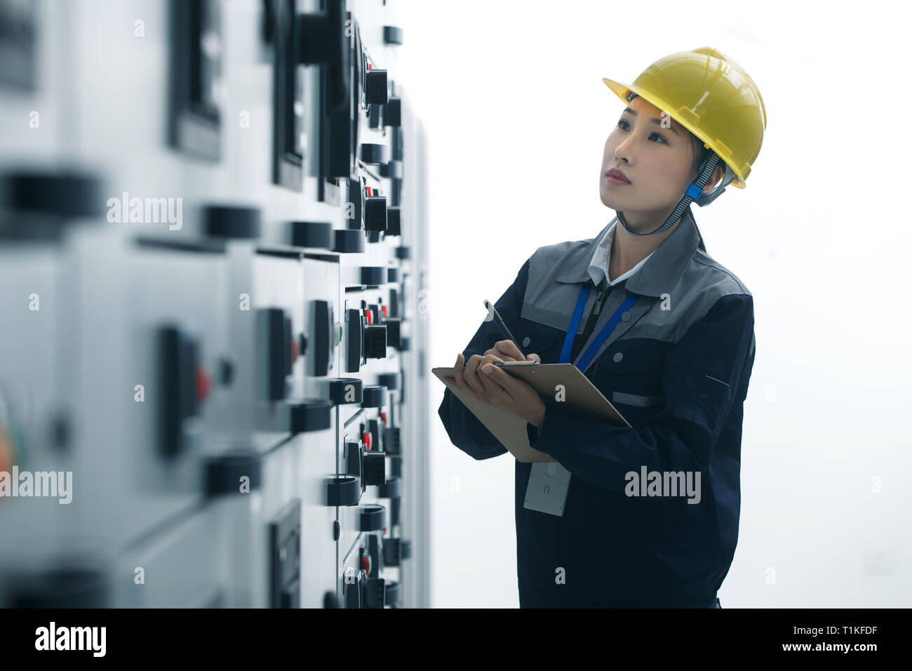 Technicians work in a factory Stock Photo - Alamy